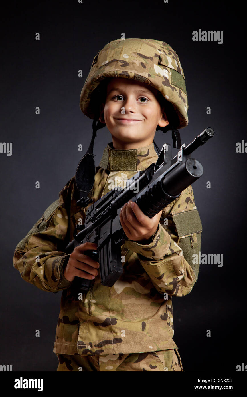 Young soldier with rifle Stock Photo - Alamy