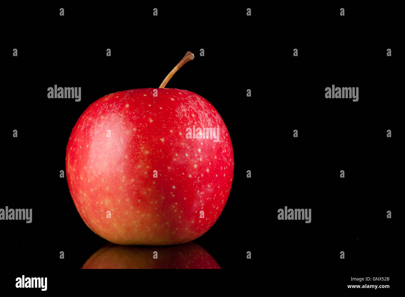 Dark-red apple. Isolated on black Stock Photo - Alamy