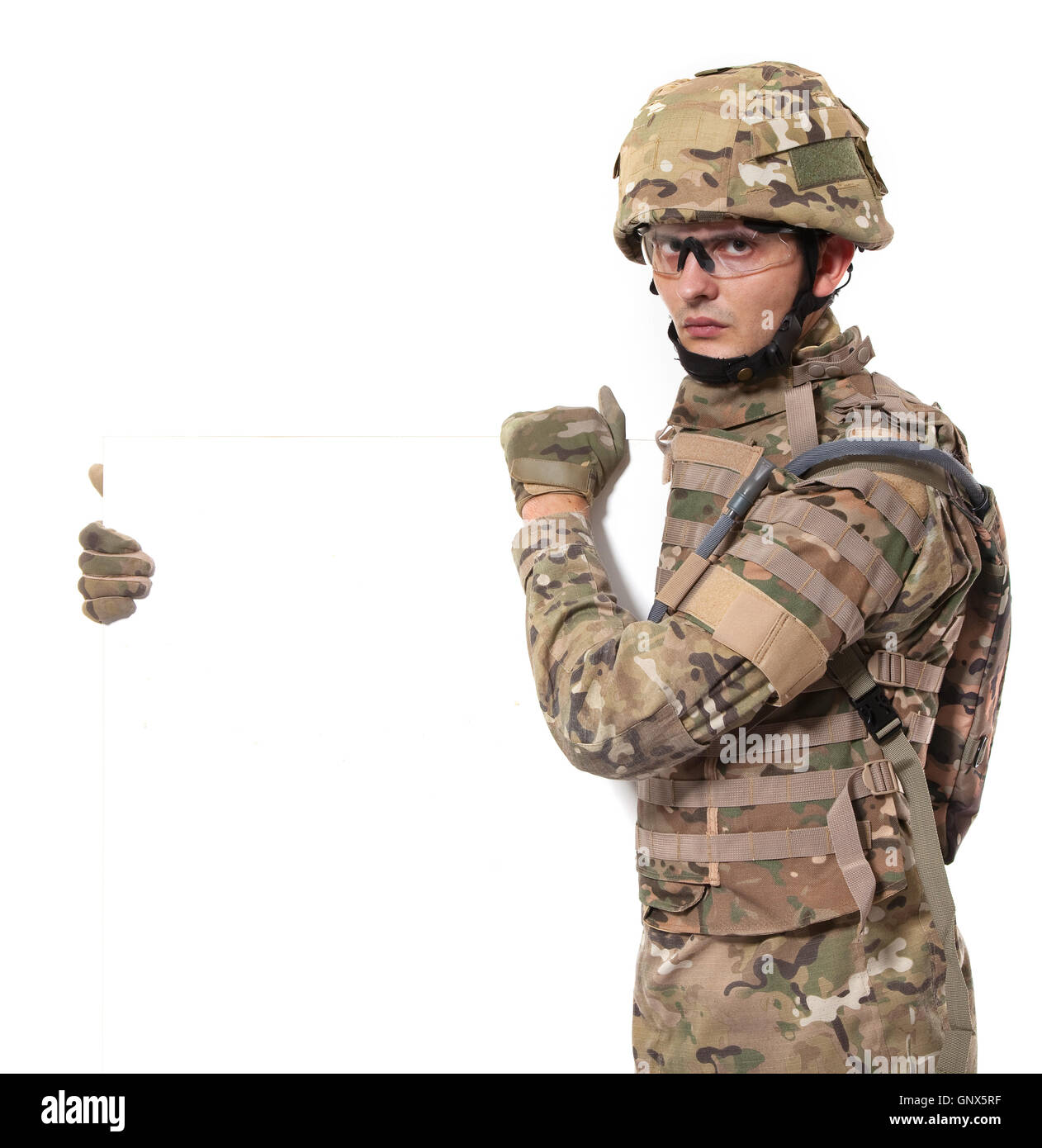 Modern soldier holding a poster Stock Photo - Alamy
