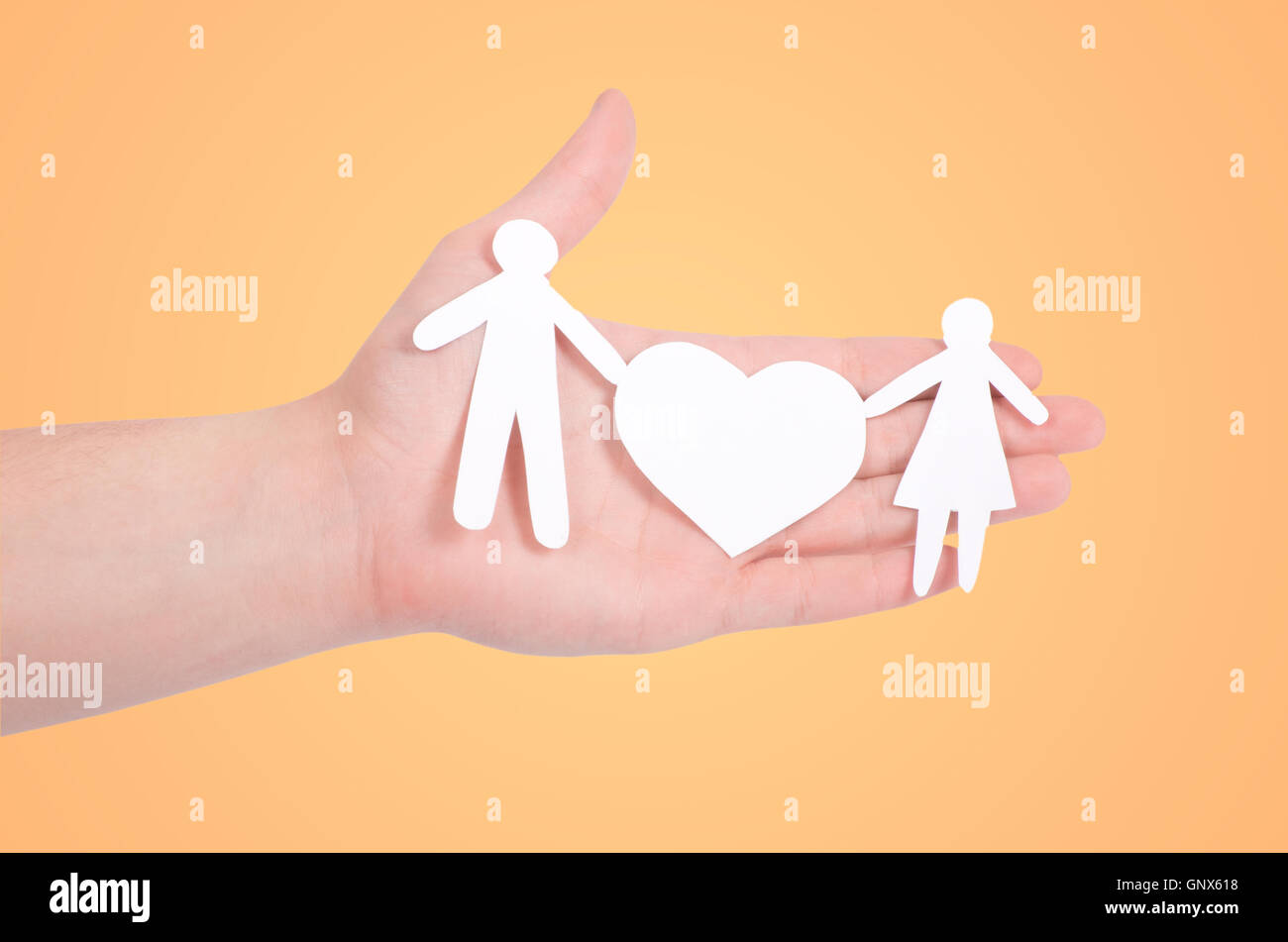 paper family in hands isolated on white Stock Photo - Alamy