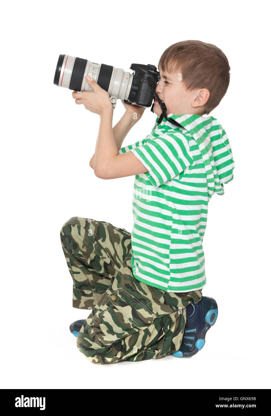 Boy holding a camera Stock Photo - Alamy