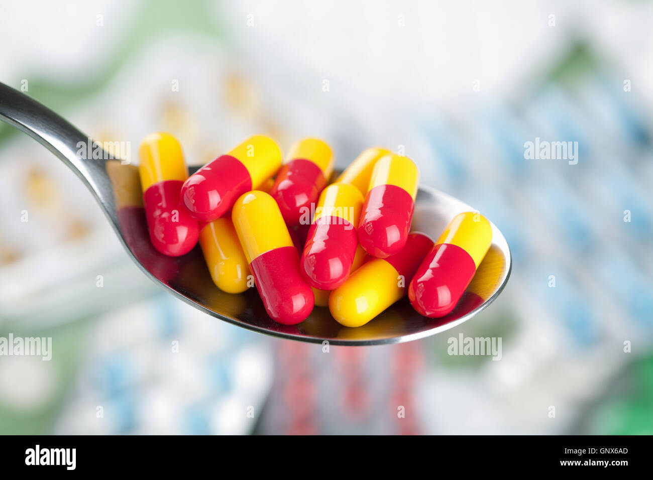 capsule pills in spoon Stock Photo - Alamy