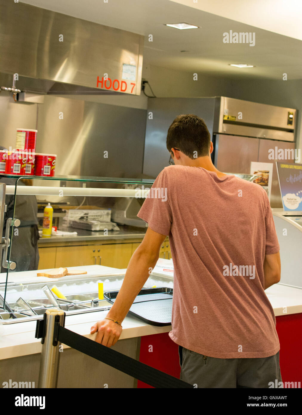 Young Man in Cafeteria Stock Photo - Alamy