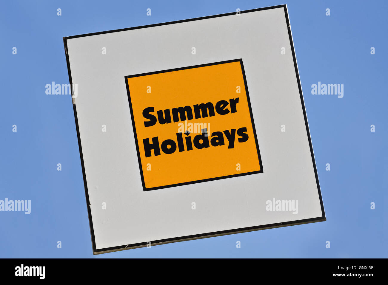Text Summer Holidays written on yellow road sign Stock Photo - Alamy