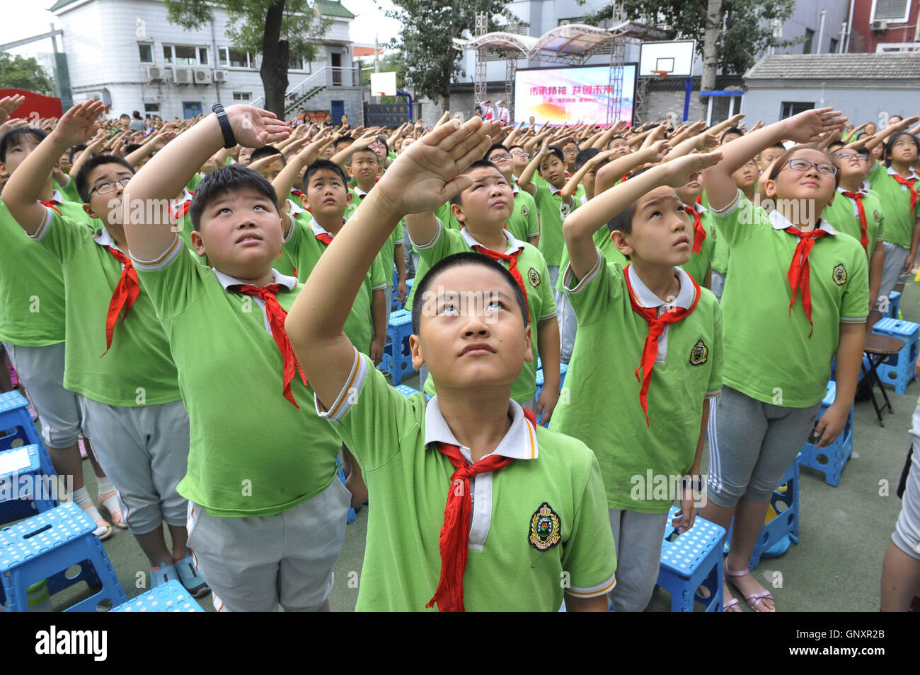 Primary school students attend flag raising hi-res stock photography ...