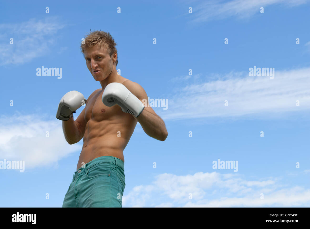 Tough guy in boxing gloves Stock Photo - Alamy