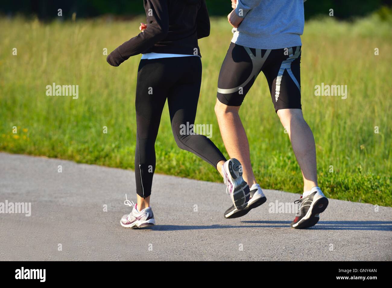 Young couple jogging Stock Photo - Alamy