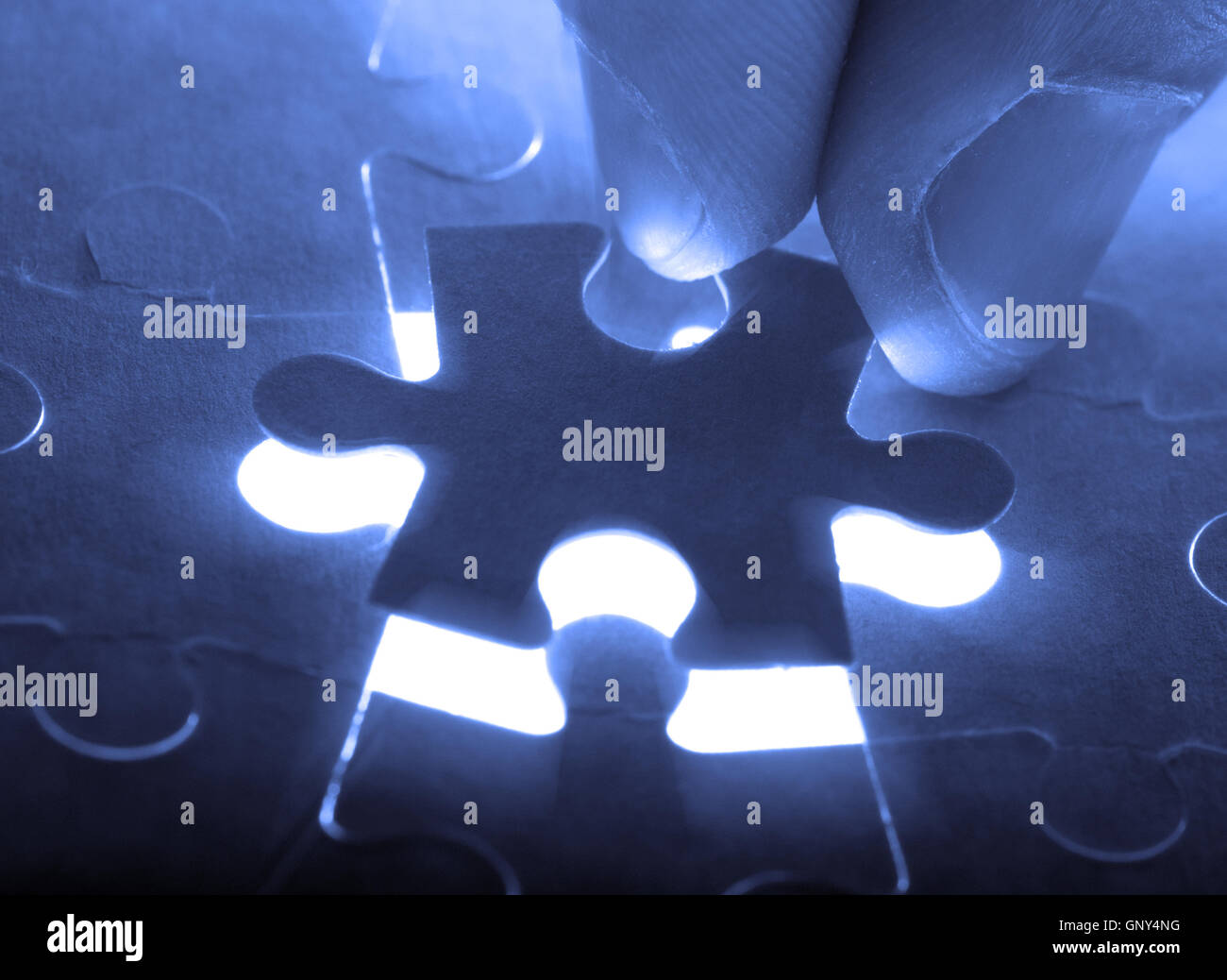 hand holding puzzle piece close up Stock Photo - Alamy