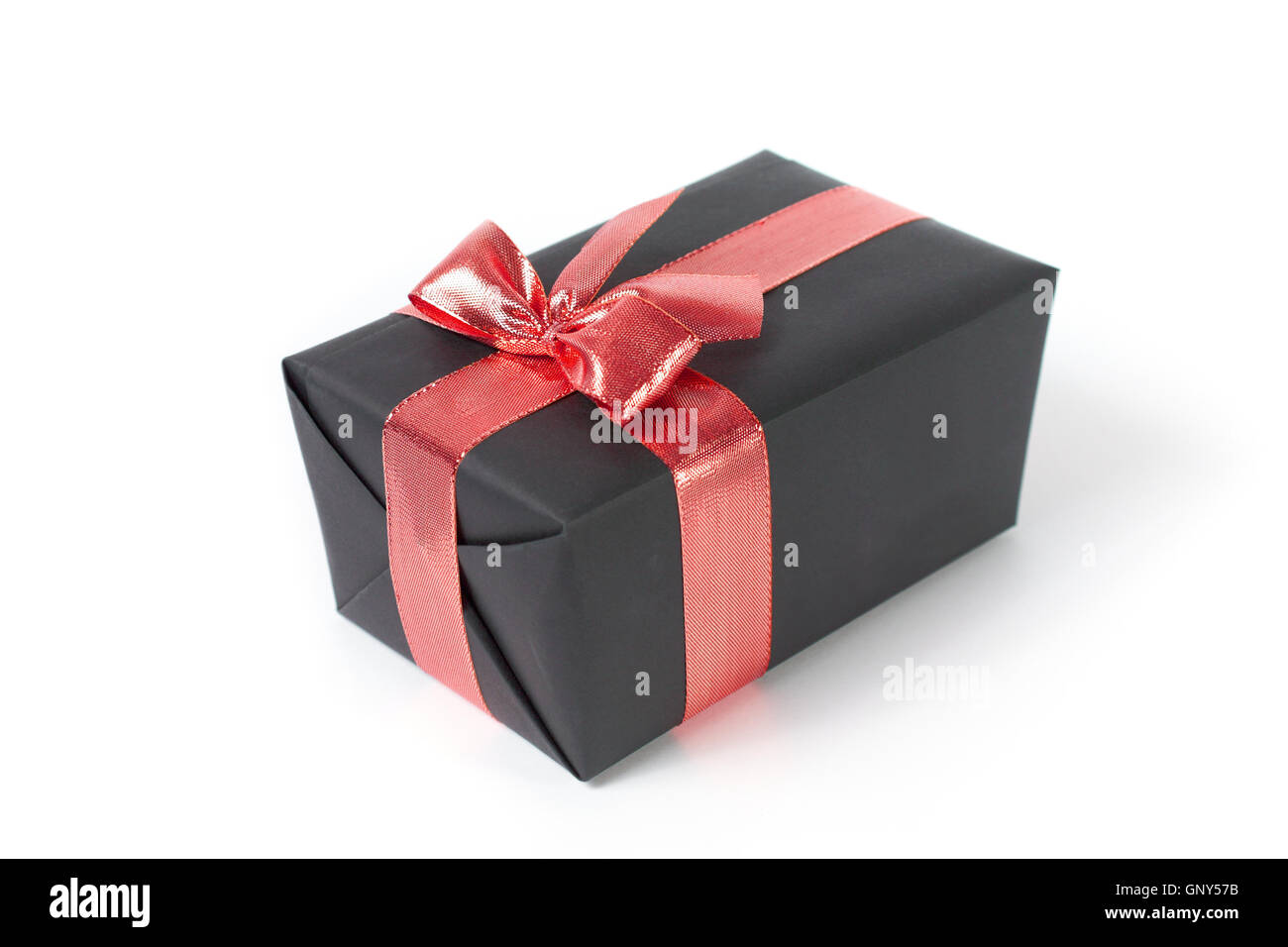 Red gift box tied Cut Out Stock Images & Pictures - Alamy