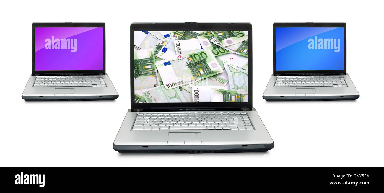 Open laptops with money Stock Photo - Alamy