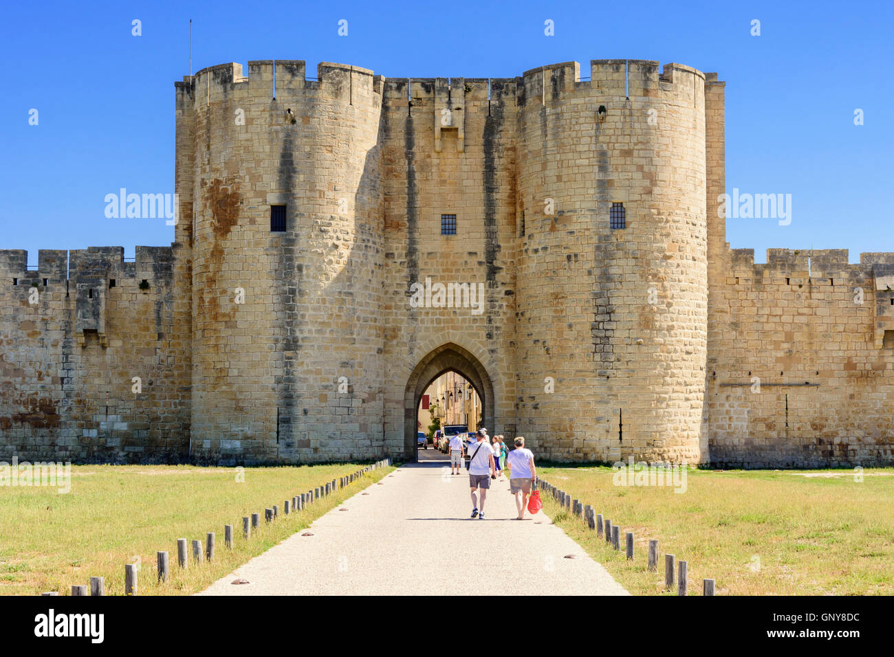 Tourists entering the old town through one of the main medieval ...