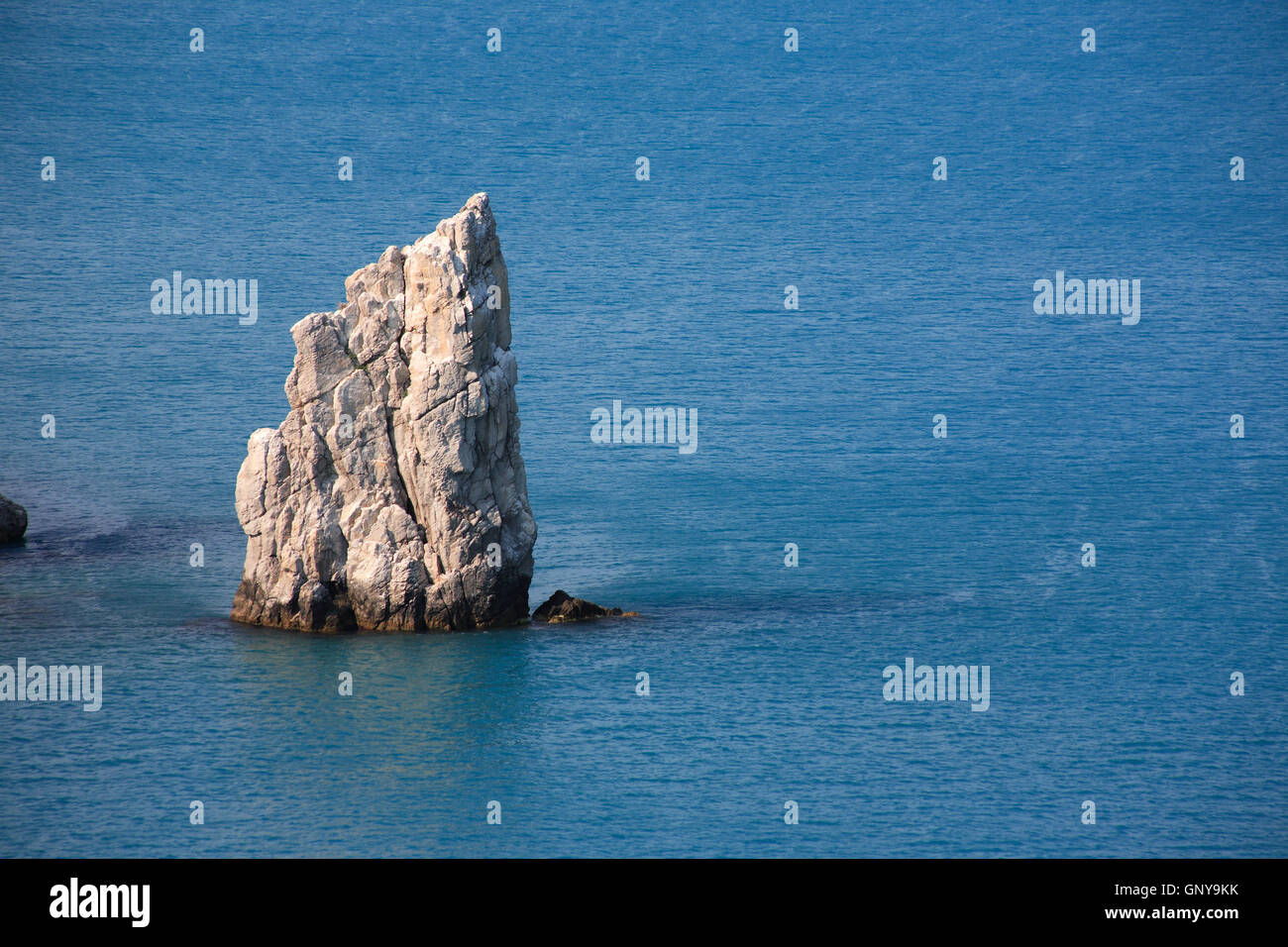 Rock In Sea Stock Photo - Alamy
