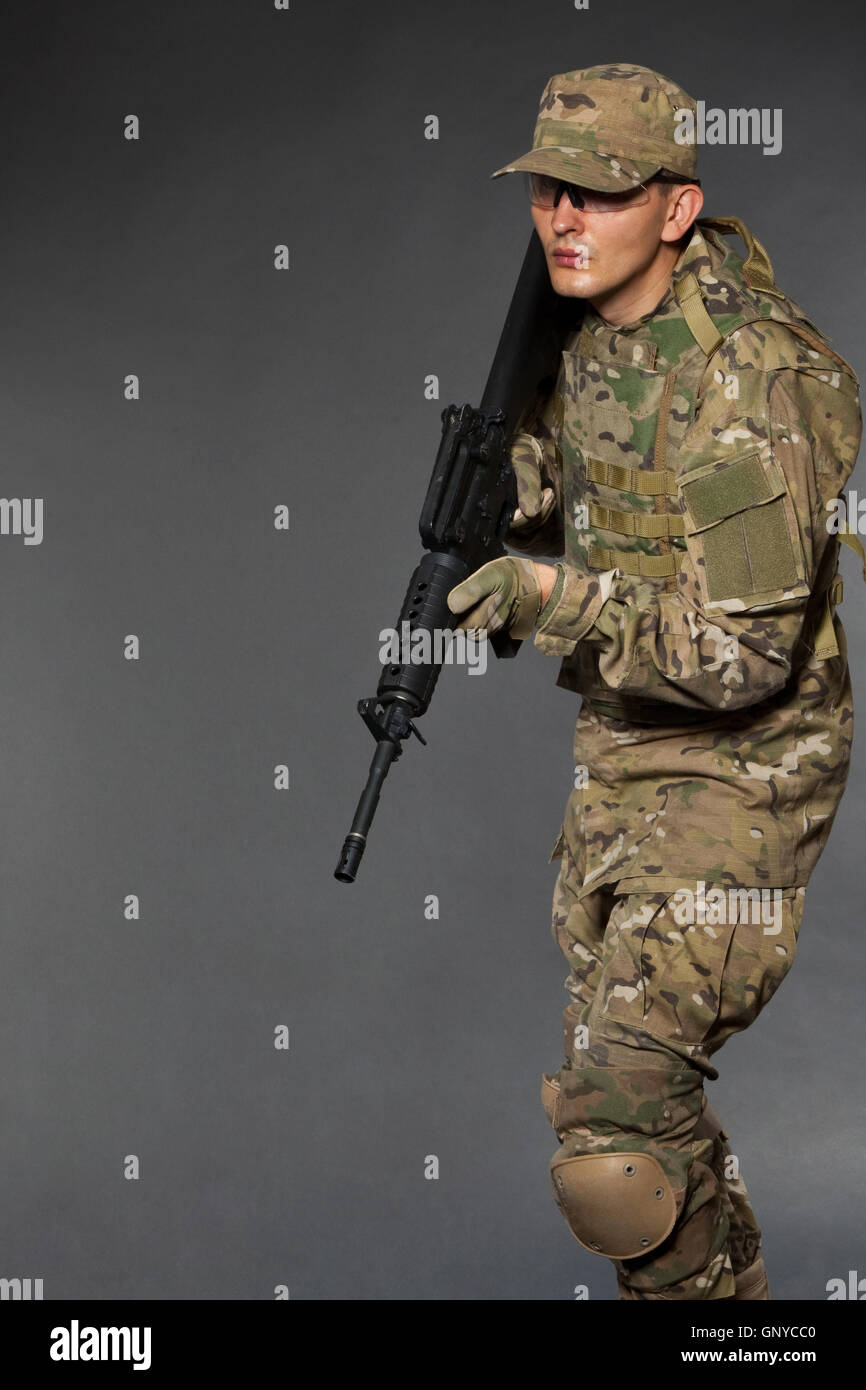 Soldier with rifle Stock Photo - Alamy