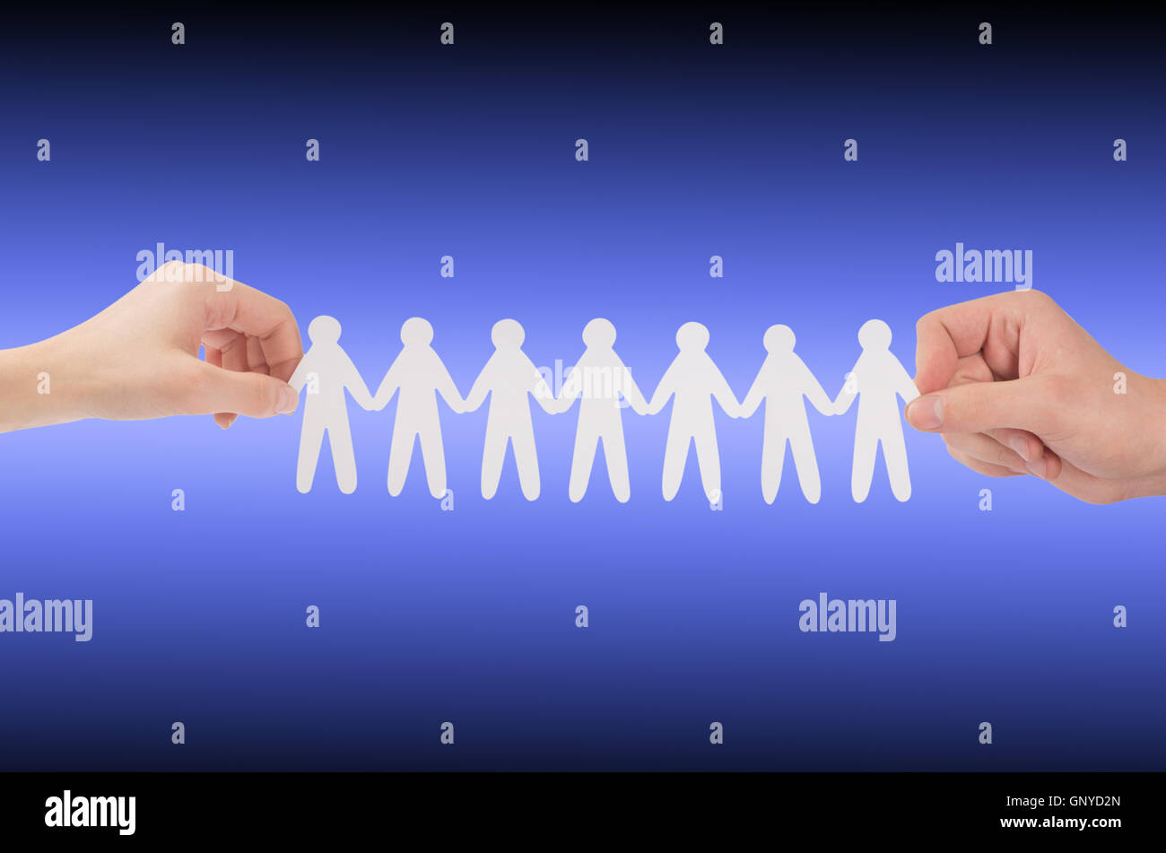 paper people in hands(man and woman Stock Photo - Alamy
