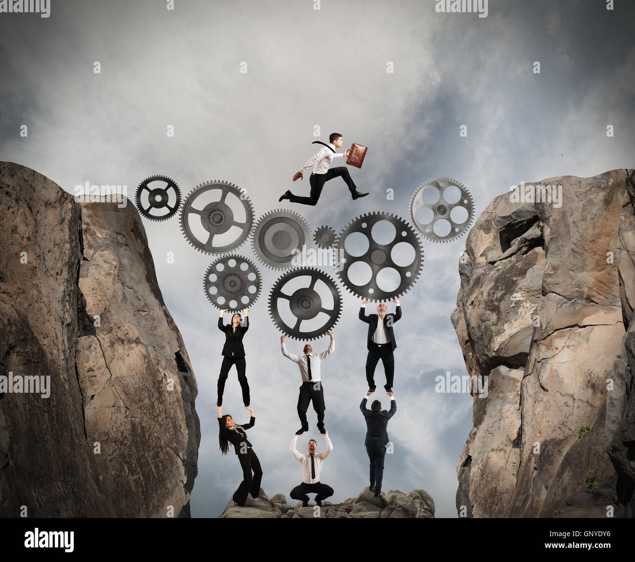 Concept of teamwork with gear system Stock Photo - Alamy