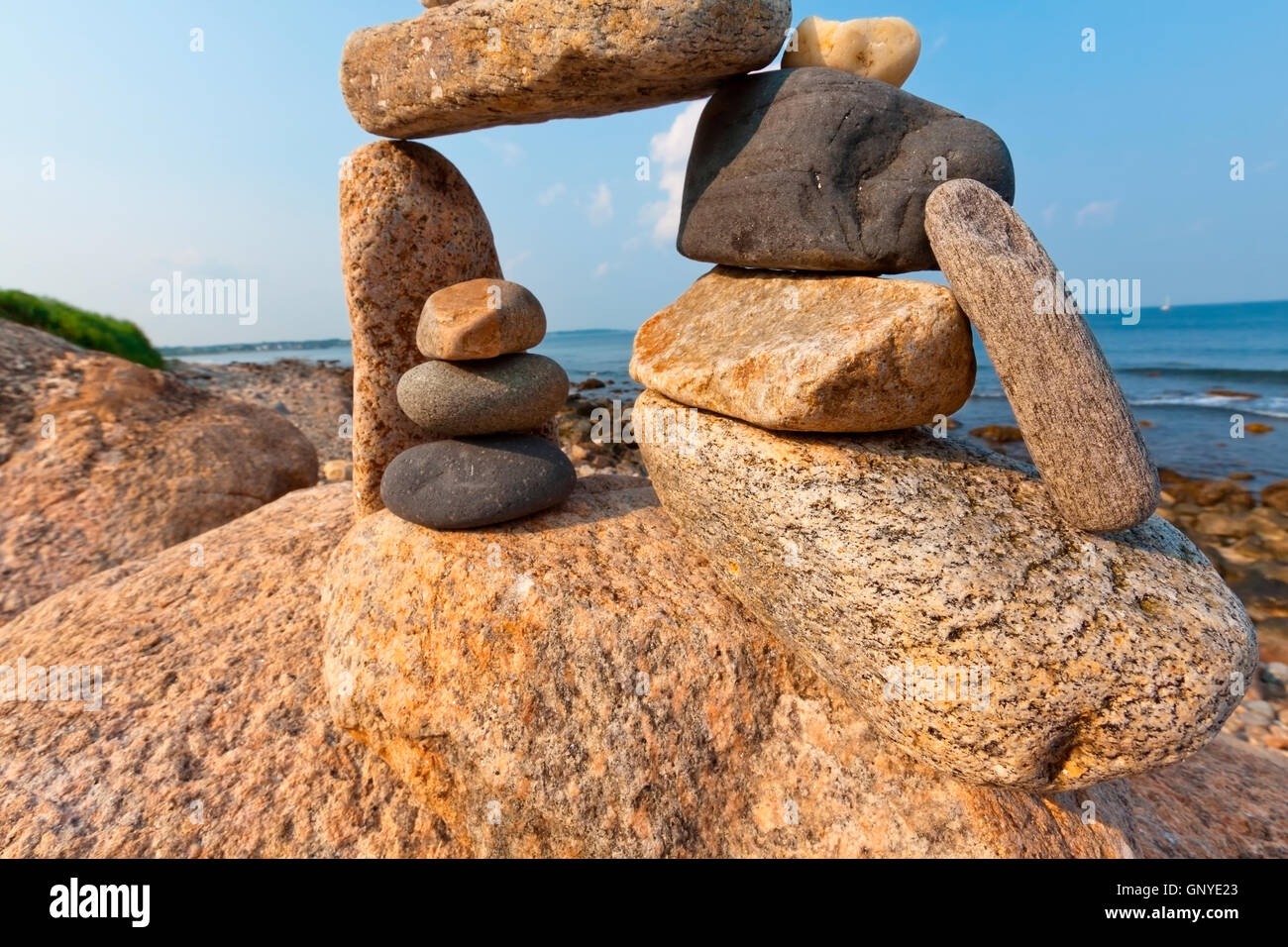 Sunset view of rocky Rhode Island sea shore through the zen-like stone ...