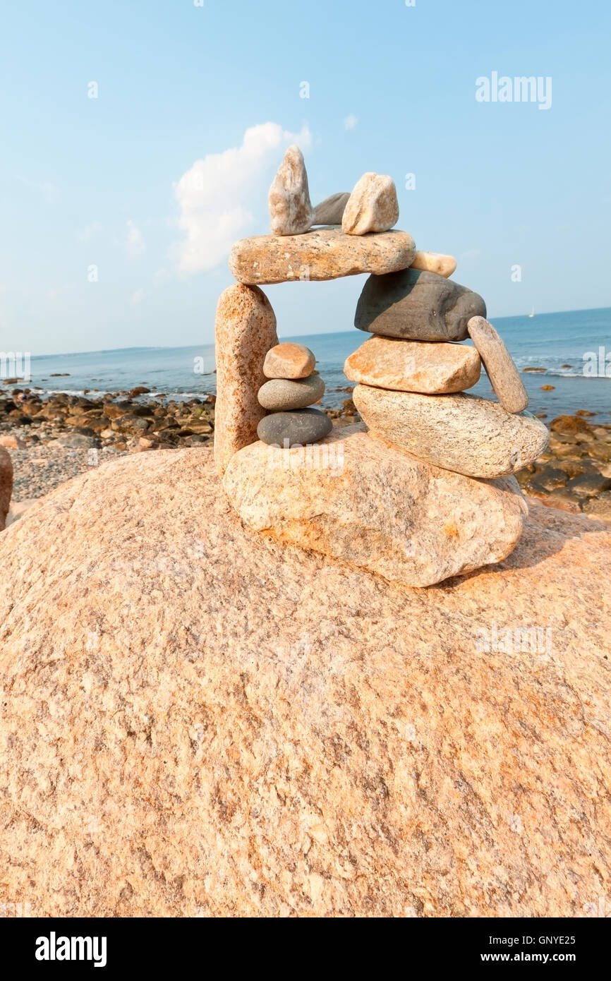 Sunset view of rocky Rhode Island sea shore through the zen-like stone ...