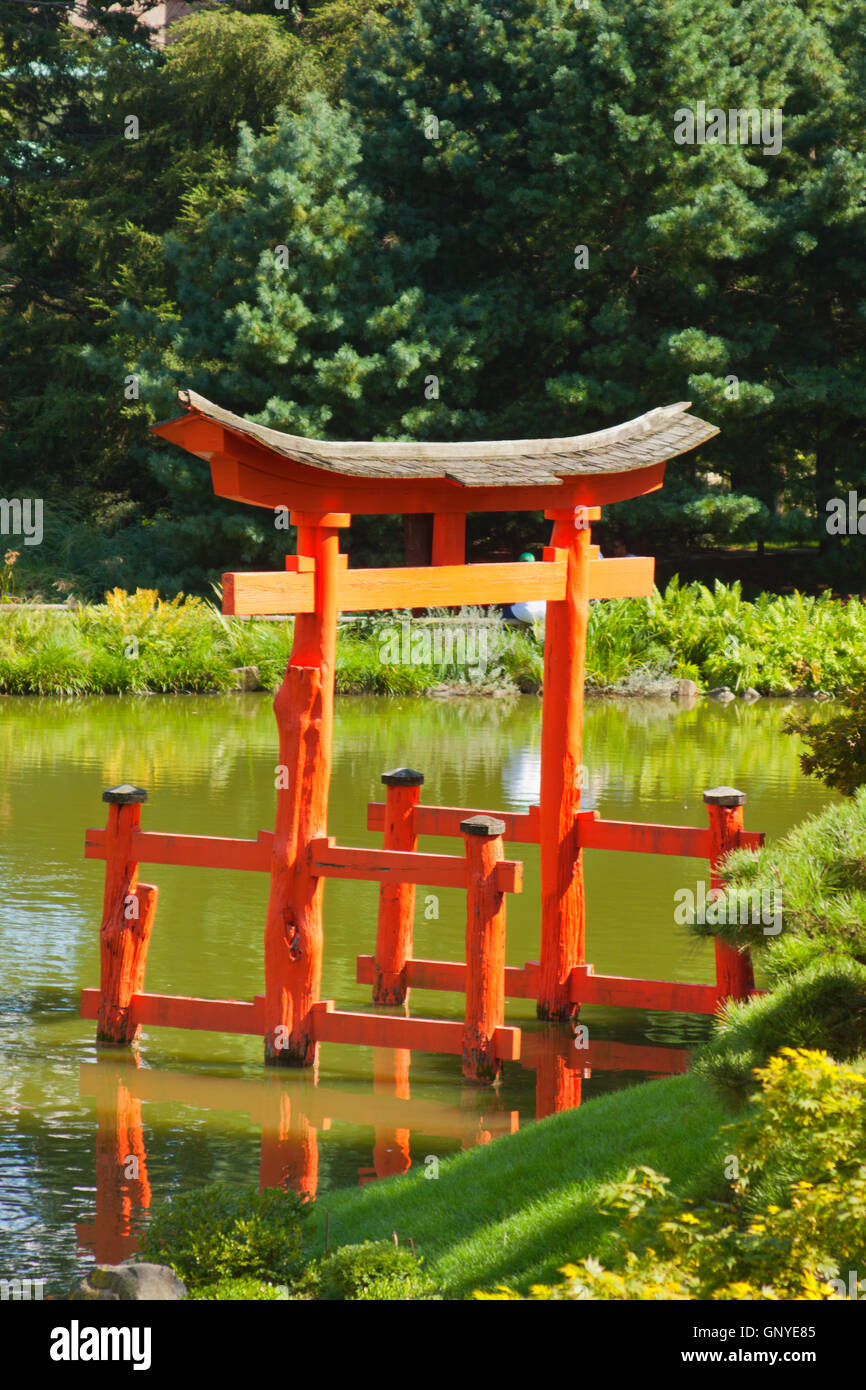 Japanese Garden and pond with a red Zen Tower Stock Photo - Alamy