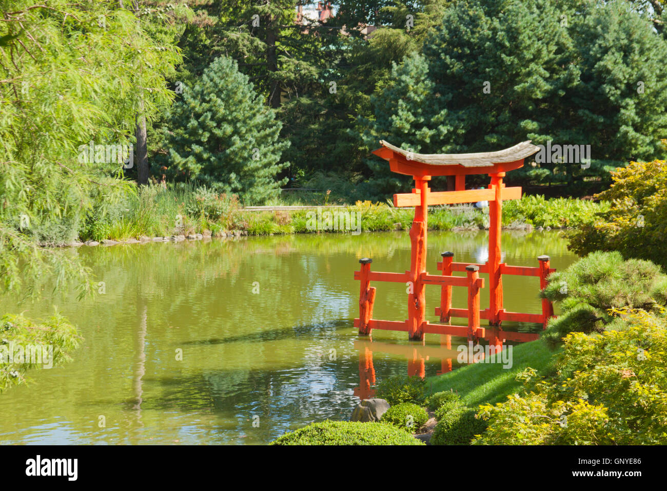 Japanese Garden and pond with a red Zen Tower Stock Photo - Alamy