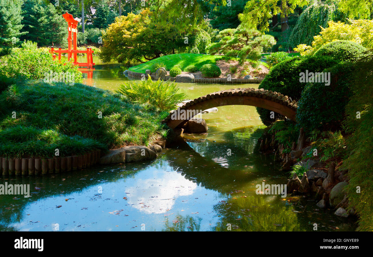 Japanese Garden and pond with a red Zen Tower Stock Photo - Alamy