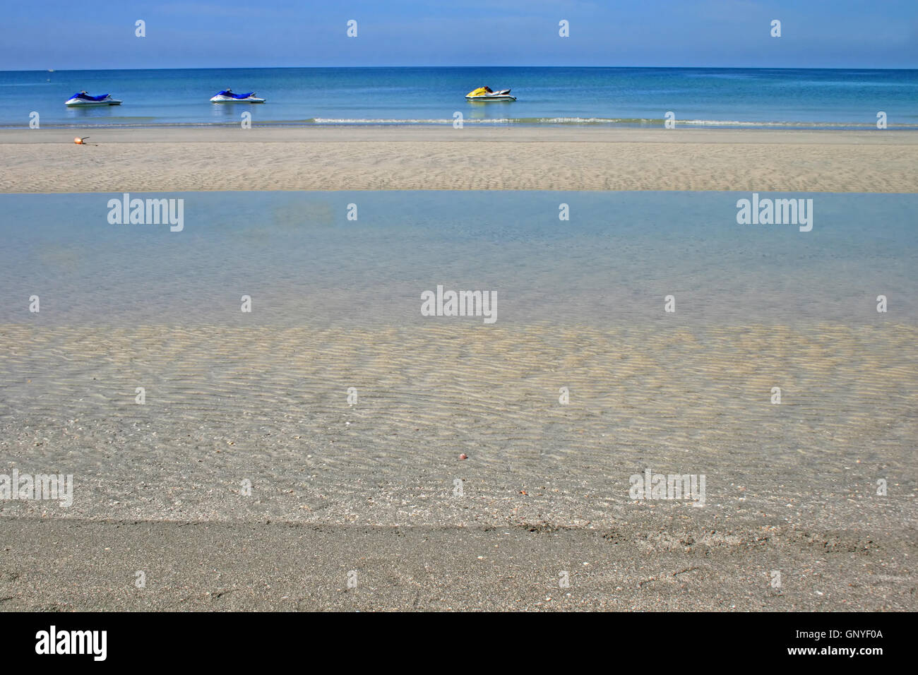 3 jet skis on the ocean near the beach Stock Photo - Alamy