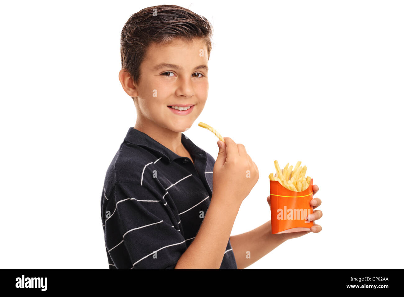 Smiling boy eating fries isolated on white background Stock Photo - Alamy