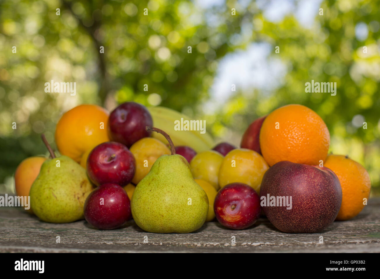 fruits in wooden table, outdoor Stock Photo - Alamy