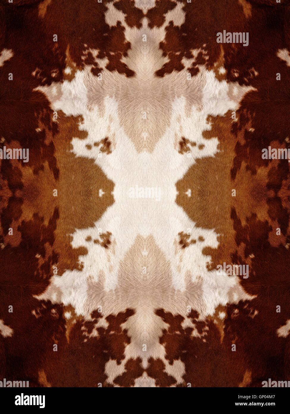 Brown and white kaleidoscope cow hide pattern Stock Photo - Alamy