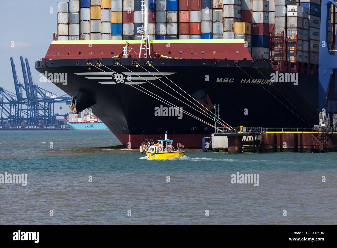 Small Yellow Ferry Boat Passing Container Ship MSC Hamburg at Port of ...