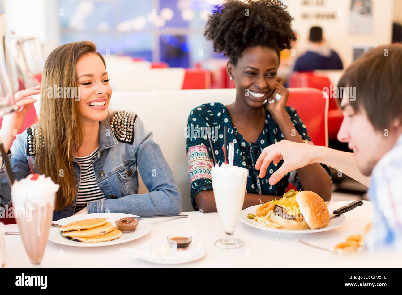 View of the women eating in the diner Stock Photo - Alamy