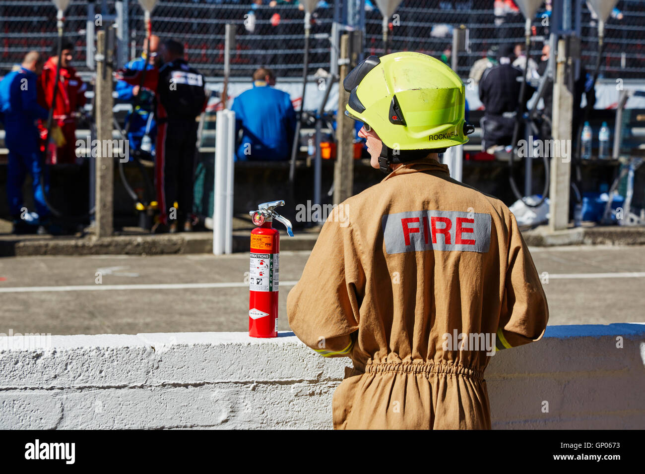 Fireman watching the pits area at the Manx Festival of Motorcycling ...