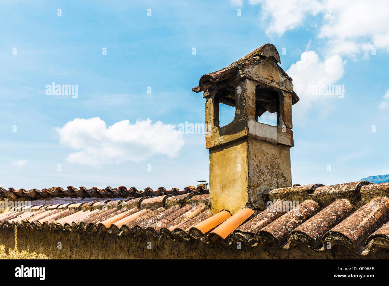 Old chimney of a house on a ceramic tiled roof Stock Photo - Alamy
