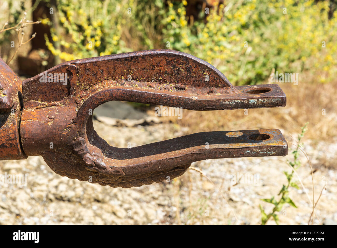 Piece of rusty metal trailer abandoned in a field Stock Photo - Alamy