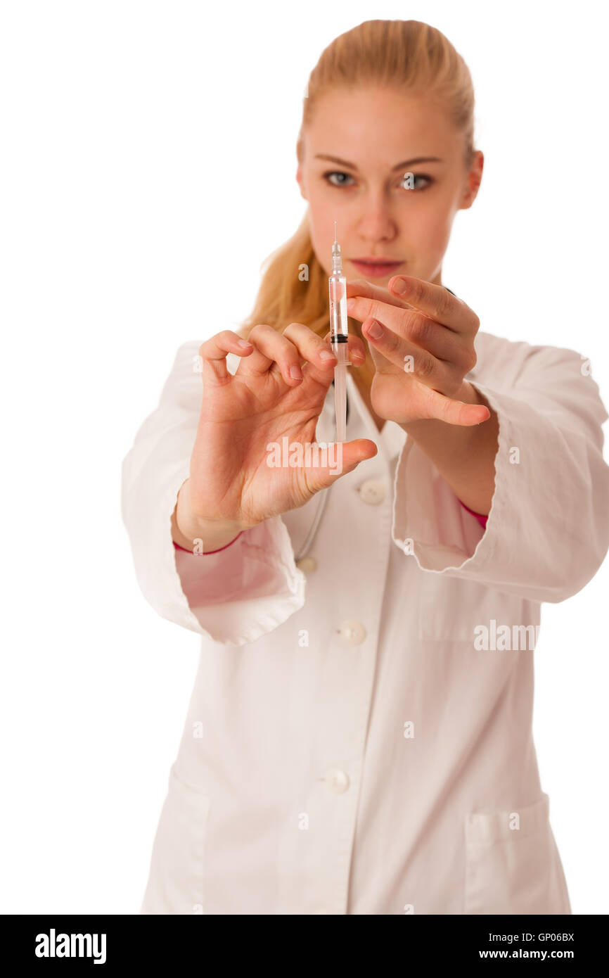Doctor with stethoscope around neck and needle in hand promoting cure ...