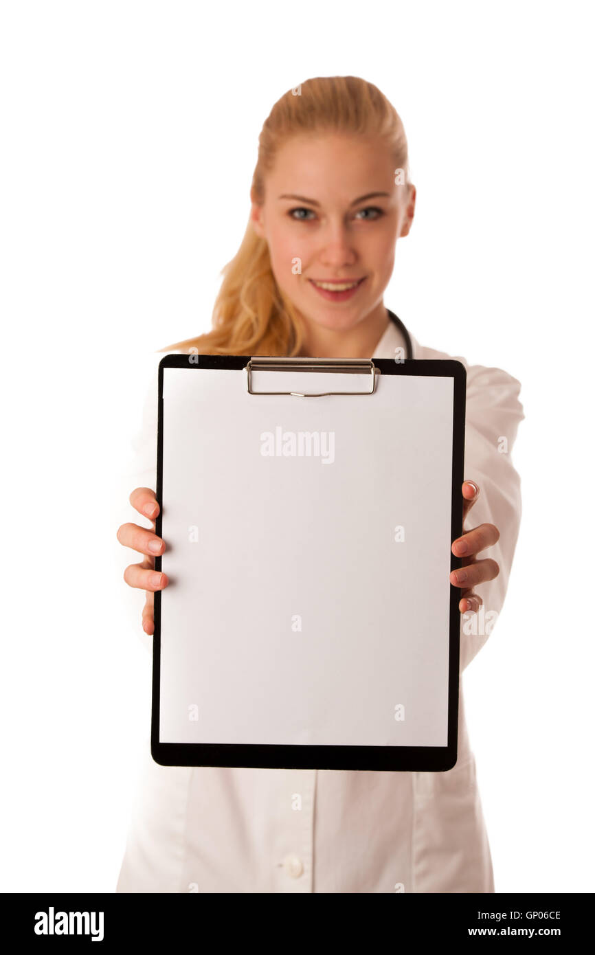 Woman doctor with stethoscope around neck showing clipboard with blank ...