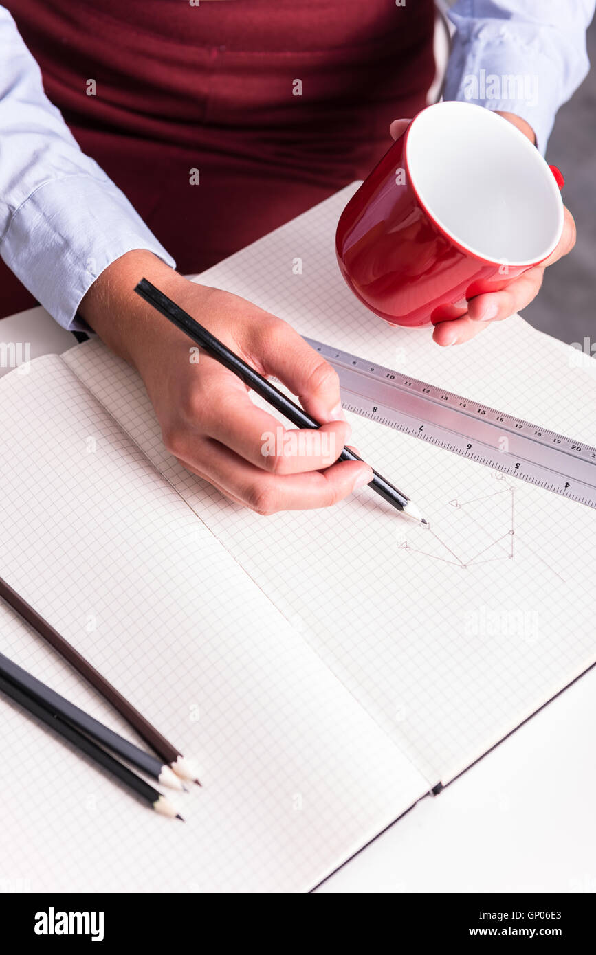 view from the top - an female engineer drawing Stock Photo - Alamy