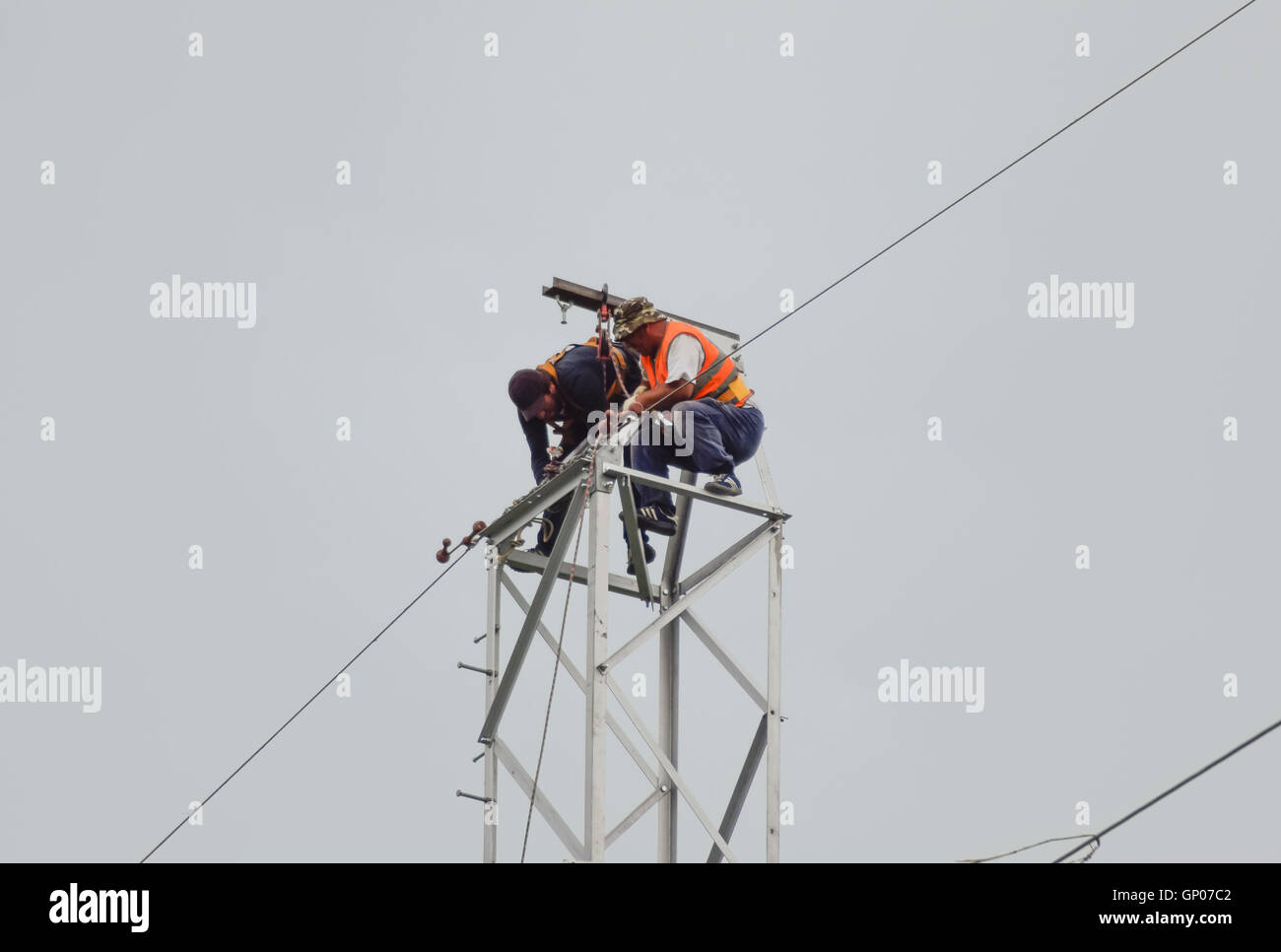 Assembly and installation of new support of a power line Stock Photo ...
