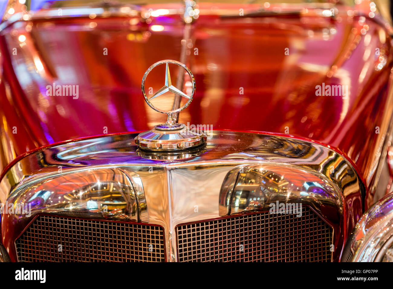 Hood Ornament and Shiny Red Hood on Red Mercedes Coupe Stock Photo - Alamy