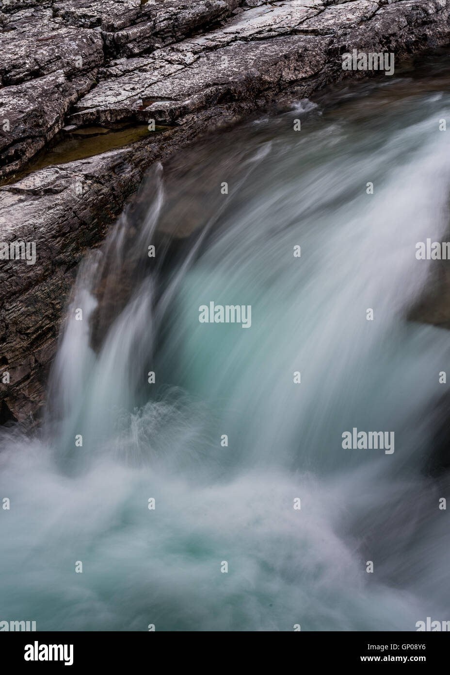 Small Cascade at McDonald Falls of clear aqua water Stock Photo - Alamy