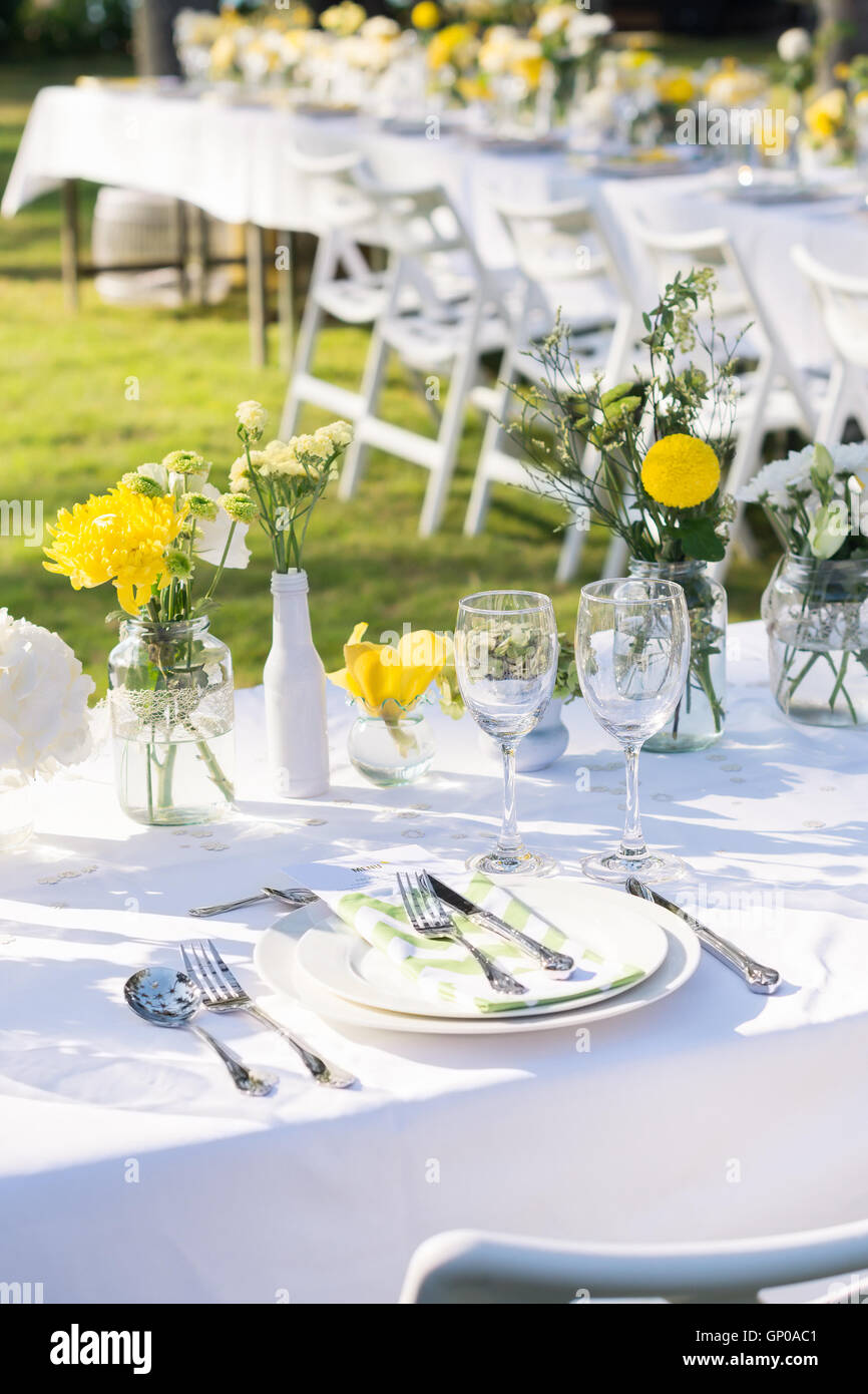 Elegance table set up white, green and yellow flowers theme, selective ...