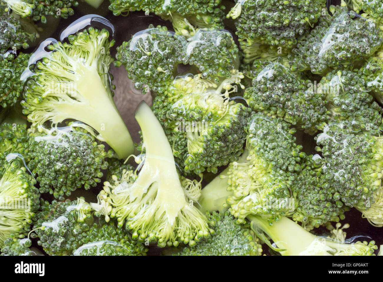 Green broccoli sliced in the water Stock Photo - Alamy