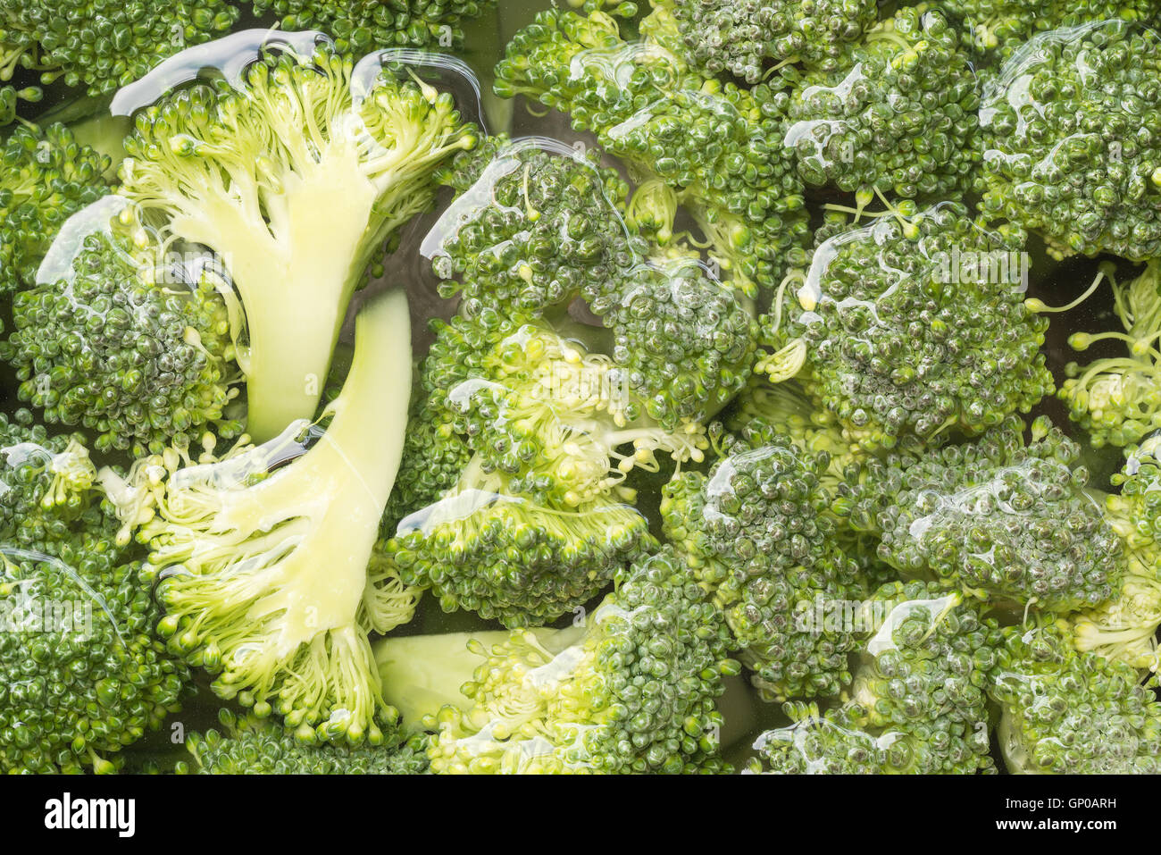 Green broccoli sliced in the water Stock Photo - Alamy