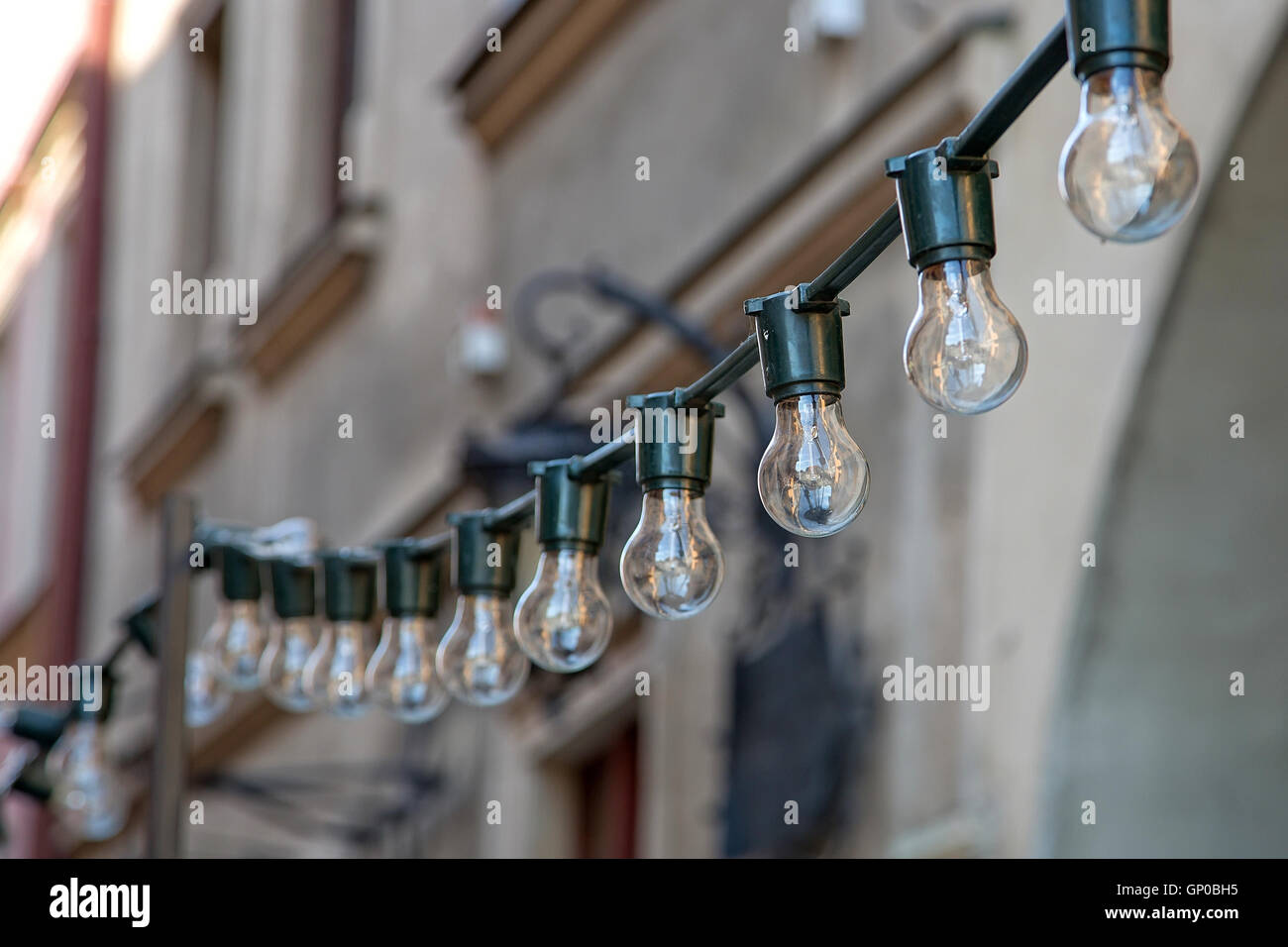 A lot of light bulbs on the cable Stock Photo - Alamy