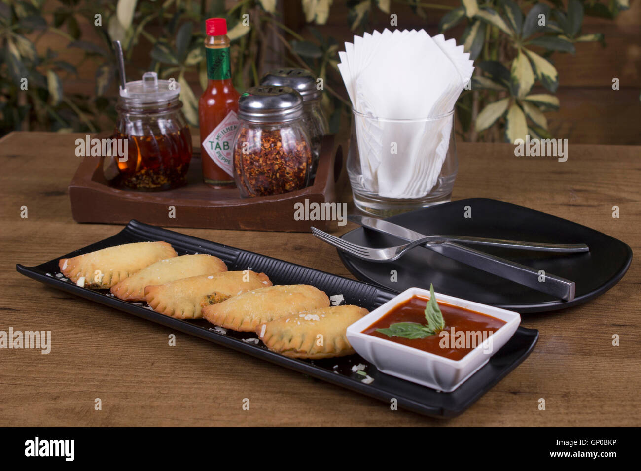 Mini panzerotti with sauce. Small versions of calzoni that are usually ...