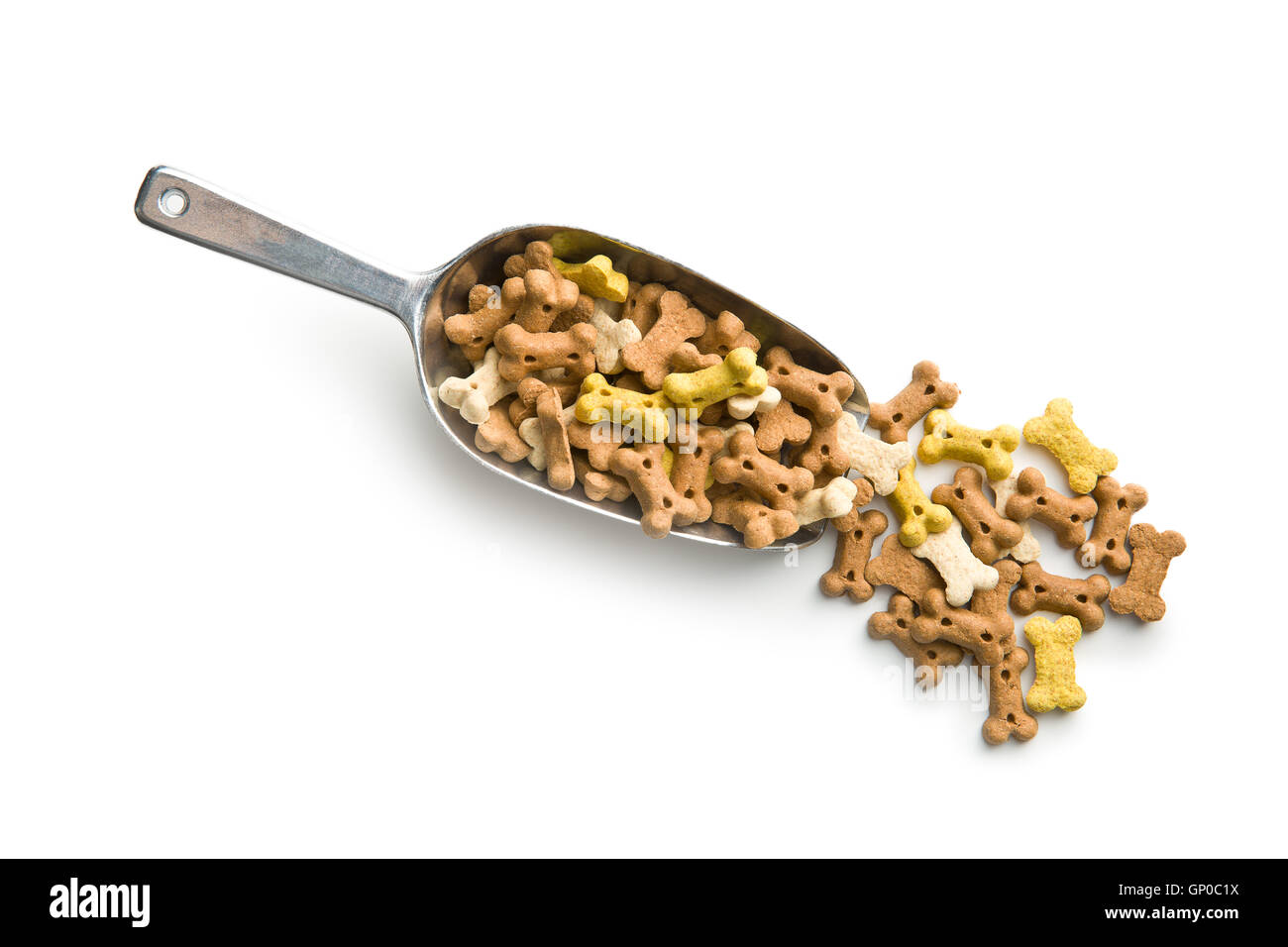 Dog food shaped like bones in scoop isolated on white background Stock ...