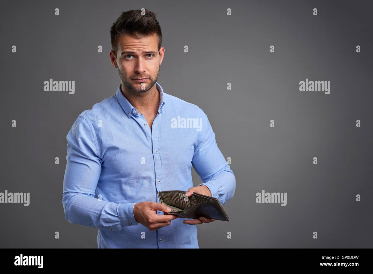 Broke young man showing empty wallet pennyless poor hi-res stock ... Broke young man showing empty wallet pennyless poor hi-res stock ...