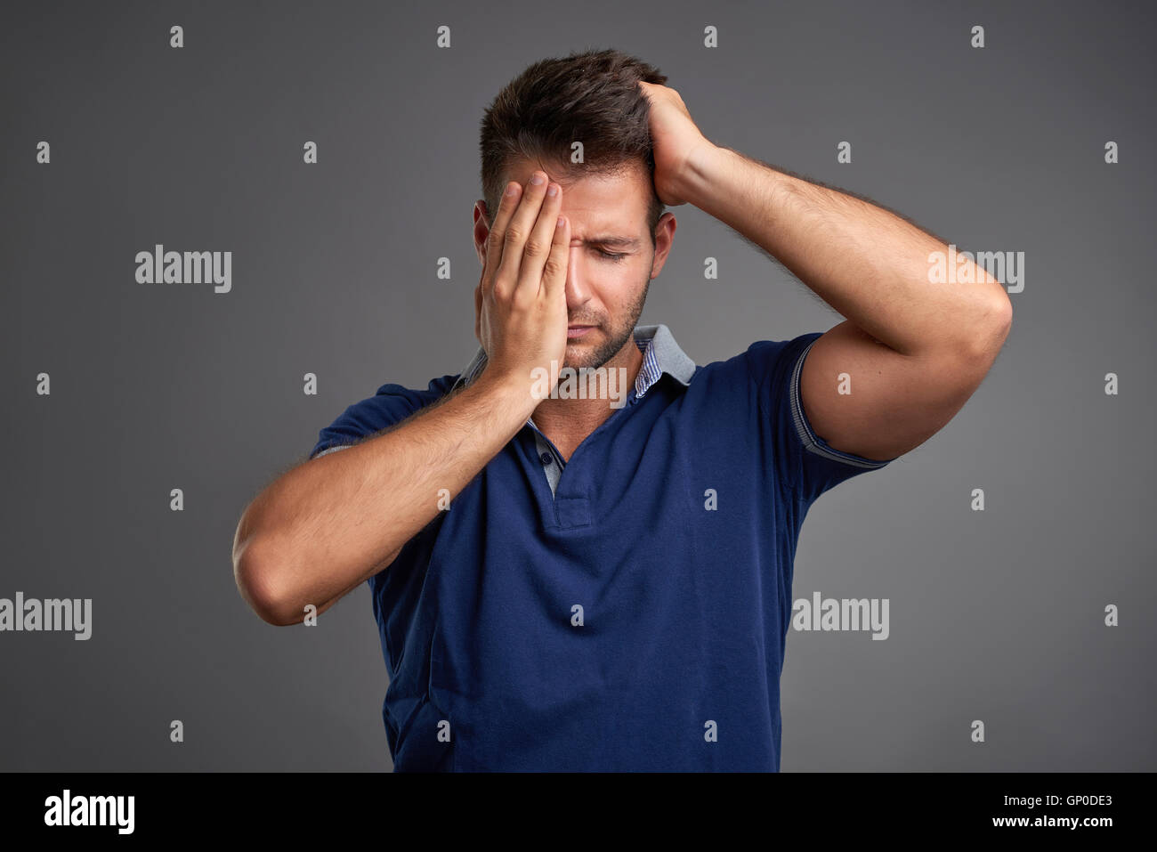 A handsome young man feeling sad and desperate Stock Photo - Alamy
