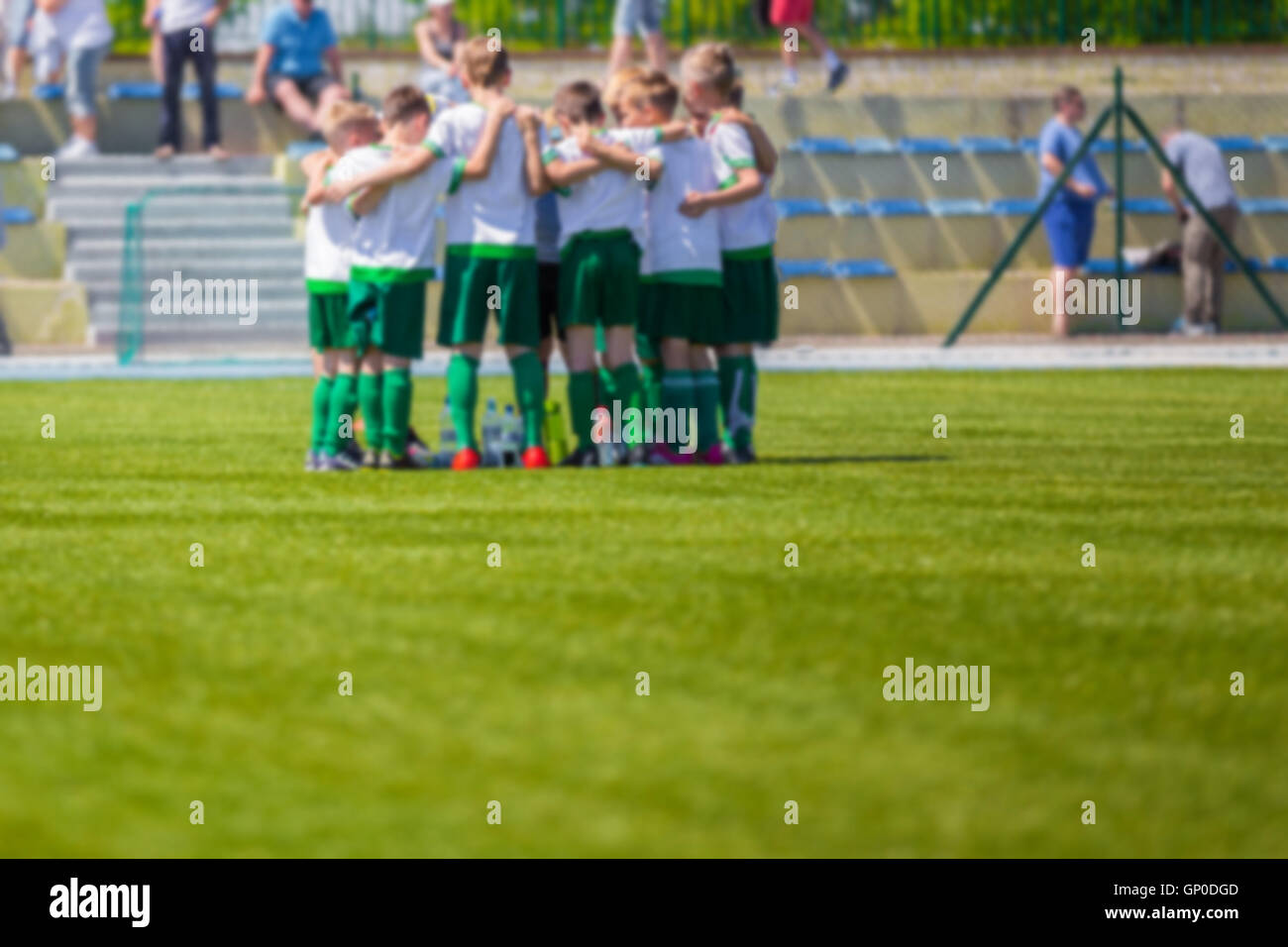 Coach giving young soccer team instructions. Youth soccer team before ...