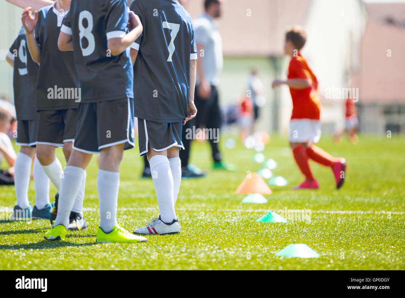 Coach giving children soccer team instructions. Young boys and soccer ...