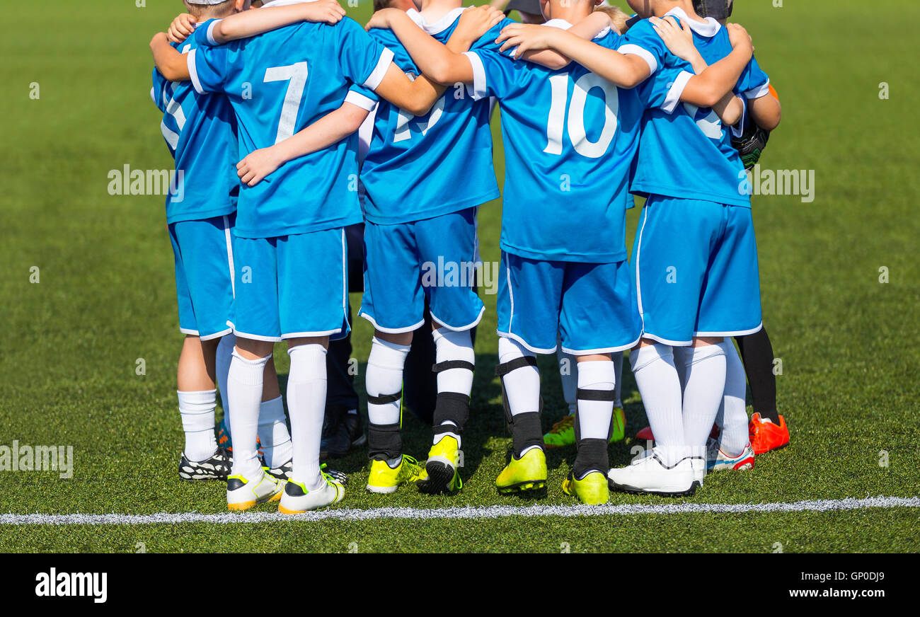 Kids with soccer coach gathering before match. Youth soccer football ...